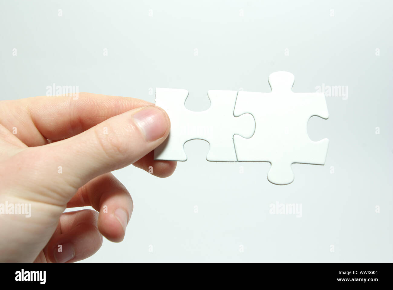 puzzle in hand isolated on white background Stock Photo - Alamy