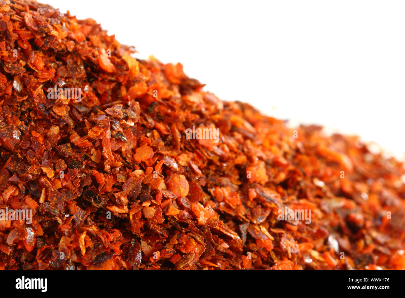closeup shot of Aleppo Flakes red chillie pepper, soft focus, isolated ...