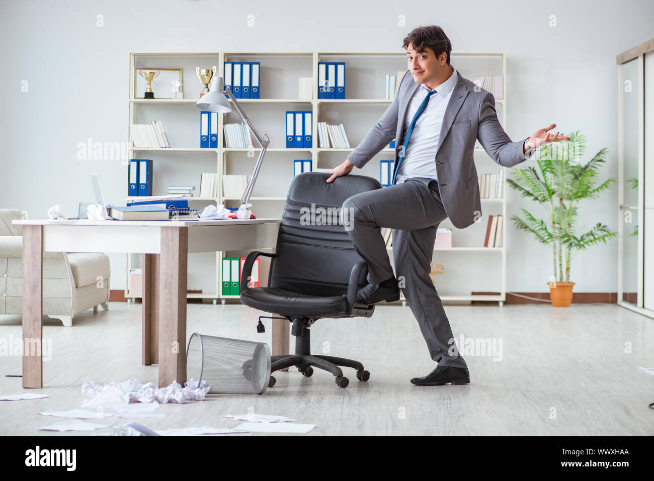 Businessman having fun taking a break in the office at work Stock Photo ...