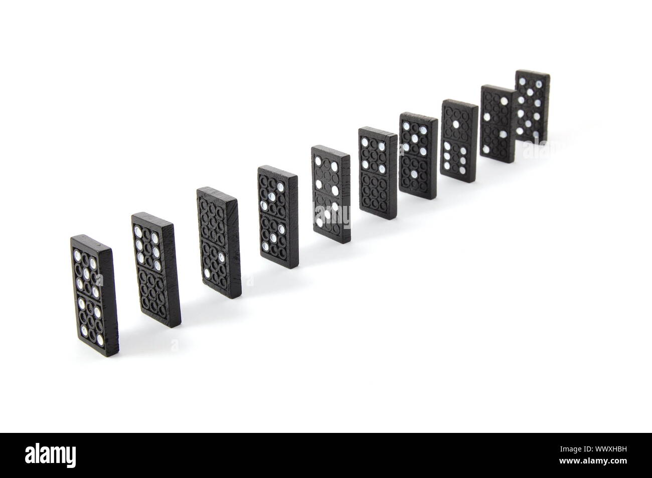 chain of dominoes isolated on a white background Stock Photo - Alamy