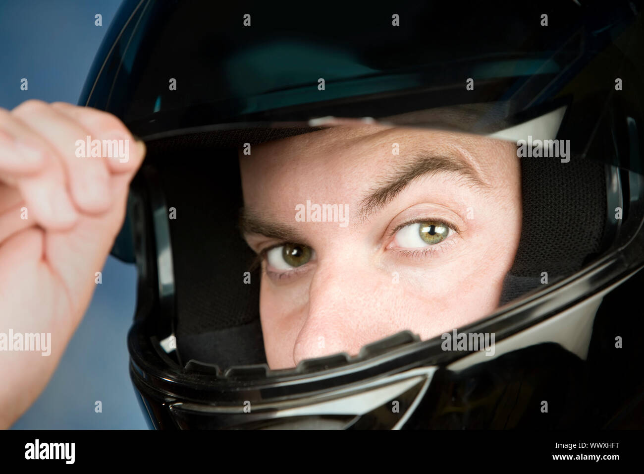 Close-up of a man wearing a motorcycle helmet Stock Photo - Alamy