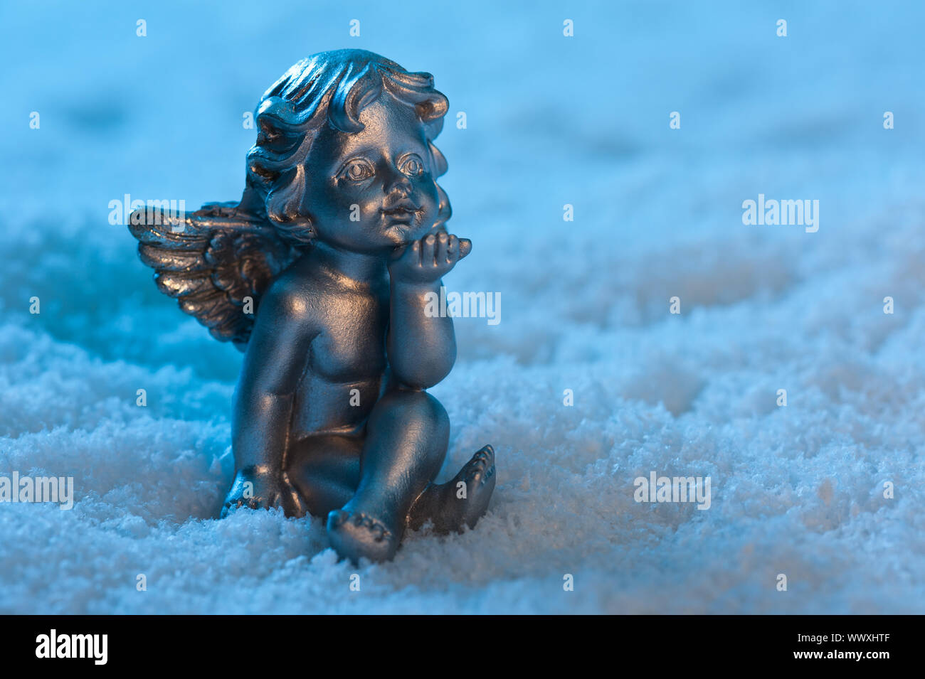 Angel in the snow Stock Photo - Alamy