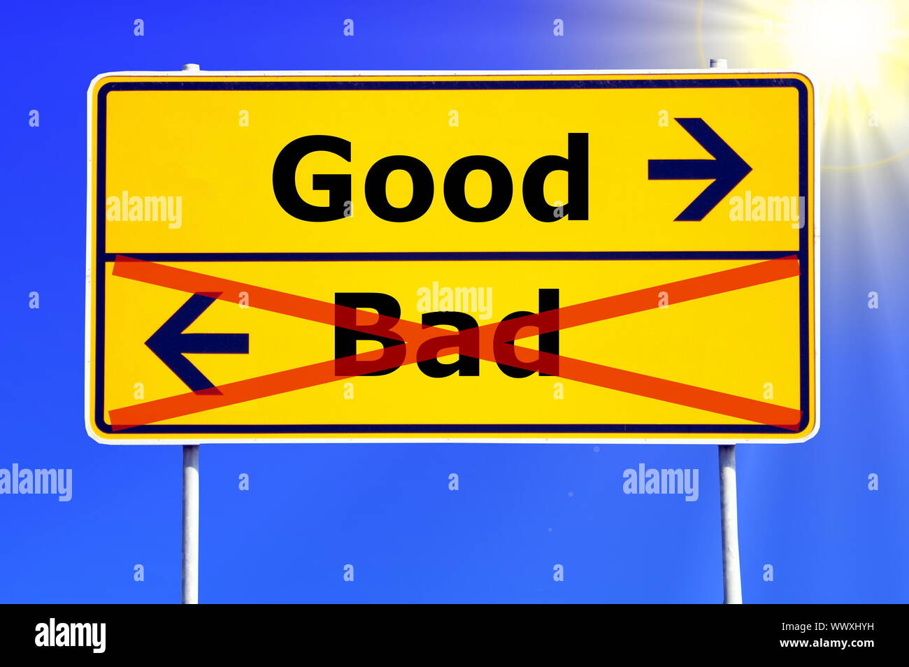 good and bad choice concept with yellow road sign Stock Photo - Alamy