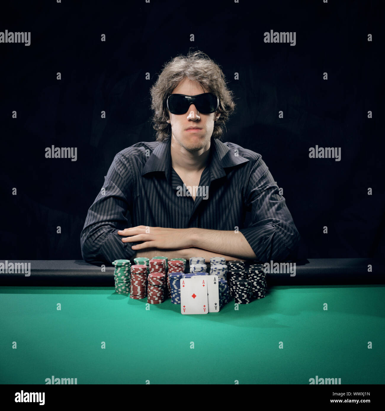 Portrait of a professional poker player Stock Photo - Alamy
