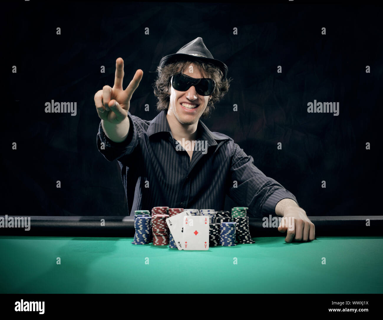 Portrait of a professional poker player Stock Photo - Alamy