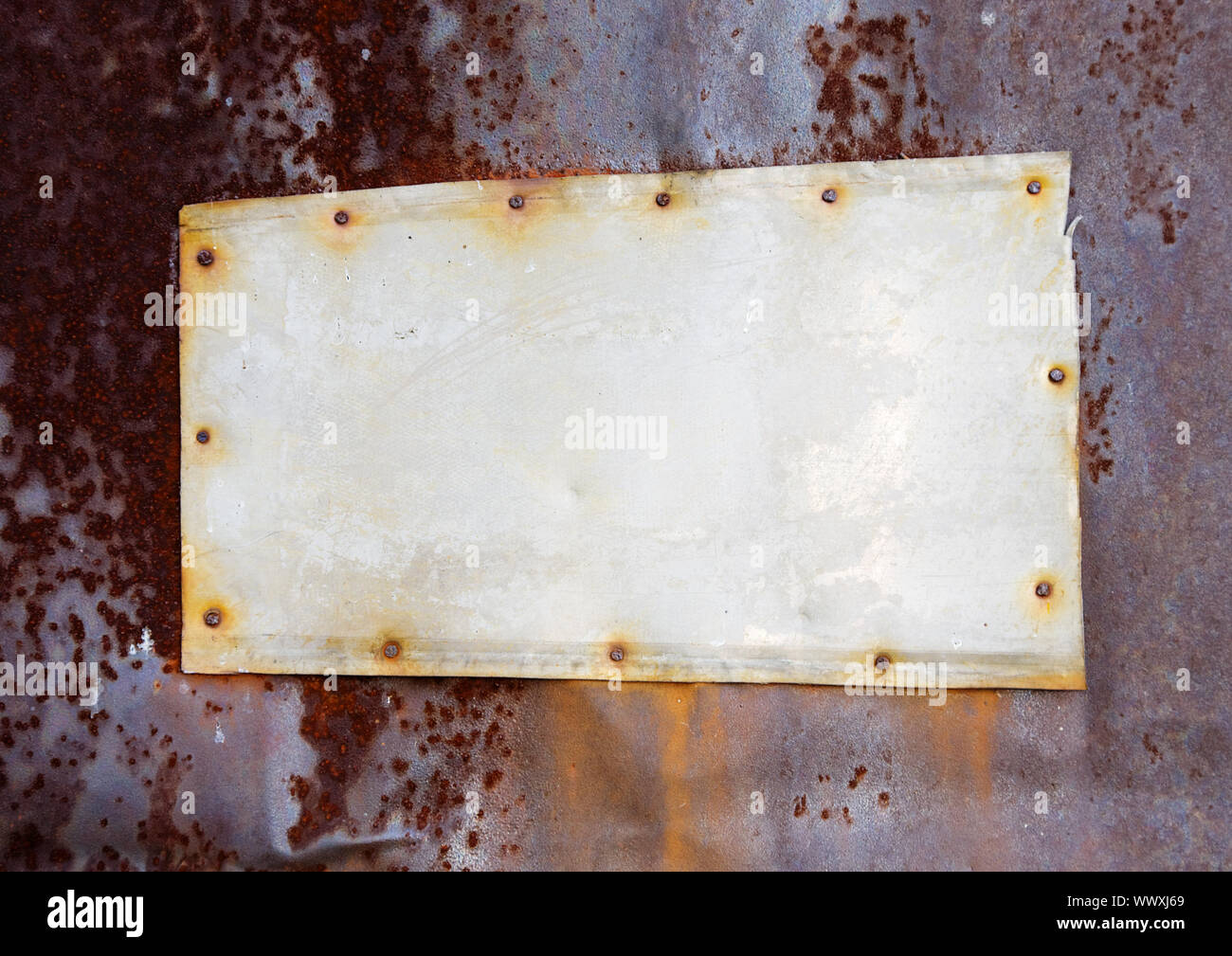 The old metal tablet on a rusty wall Stock Photo - Alamy