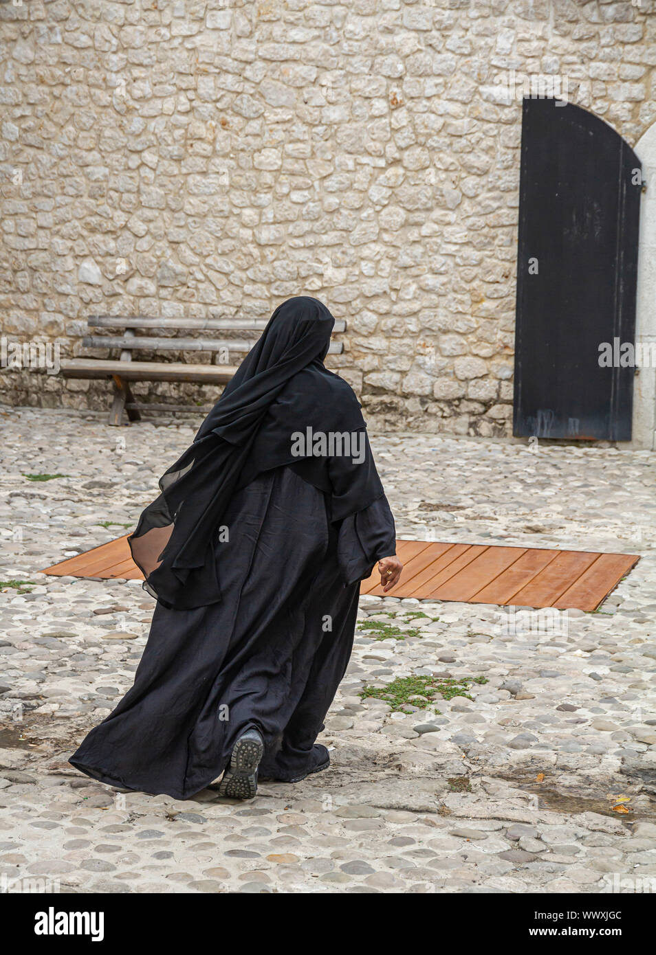 Veiled Woman entering mosque in Mostar Bosnia Stock Photo - Alamy