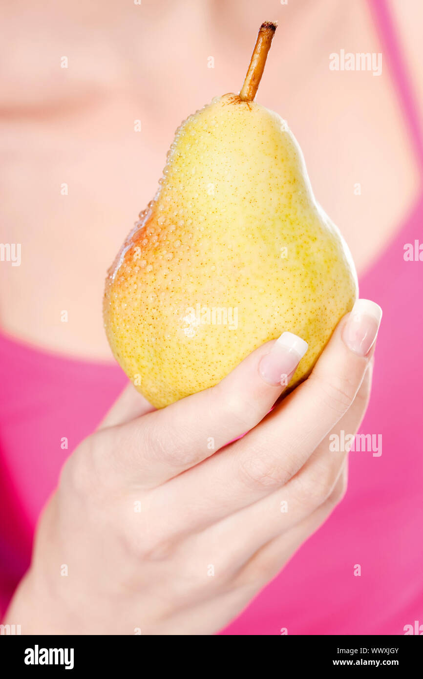 pear in woman's hand Stock Photo - Alamy