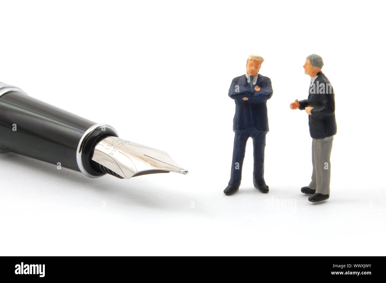 business man and pen isolated on white background Stock Photo - Alamy