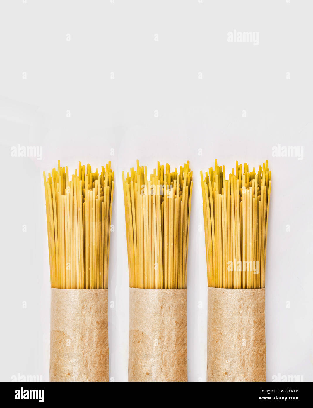 Spaghetti packed into paper on a white background. Supermarket Stock ...