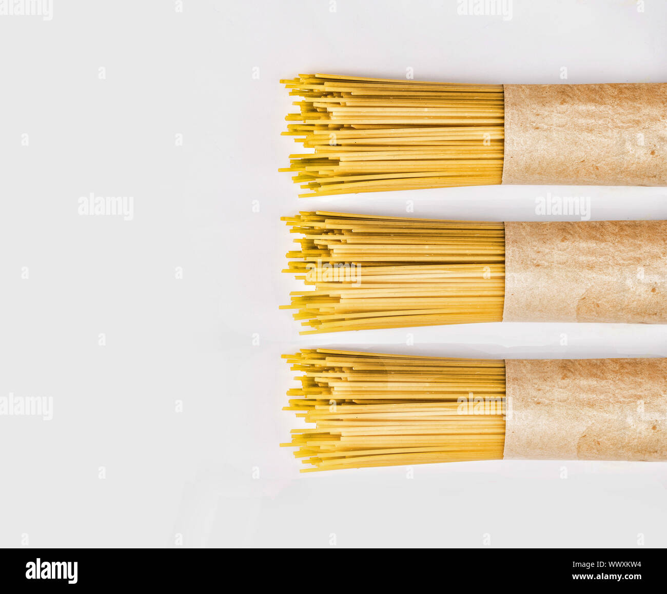 Spaghetti packed into paper on a white background. Supermarket Stock ...