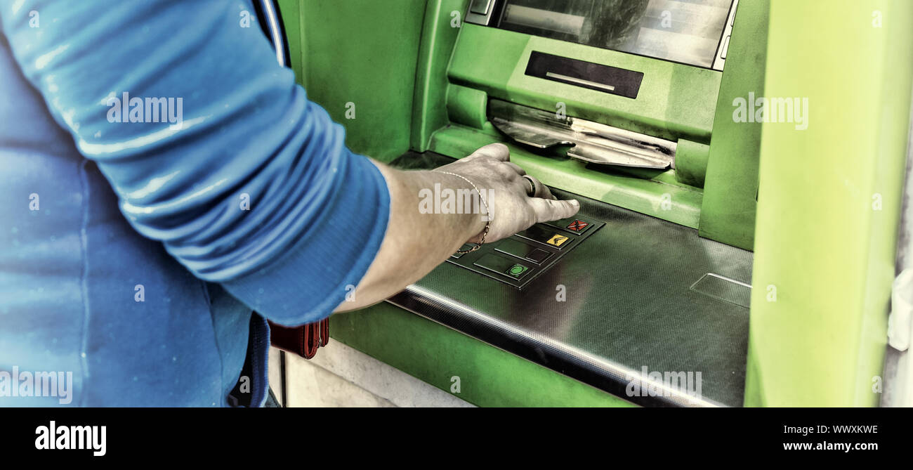 People using cashpoint hi-res stock photography and images - Alamy