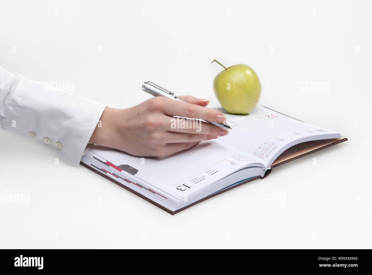 Woman hand making notes Stock Photo - Alamy