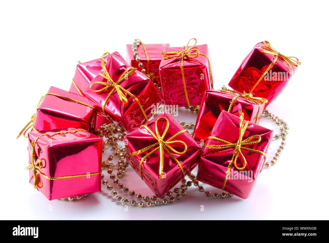 Small gift boxes with a chain on a white background Stock Photo - Alamy