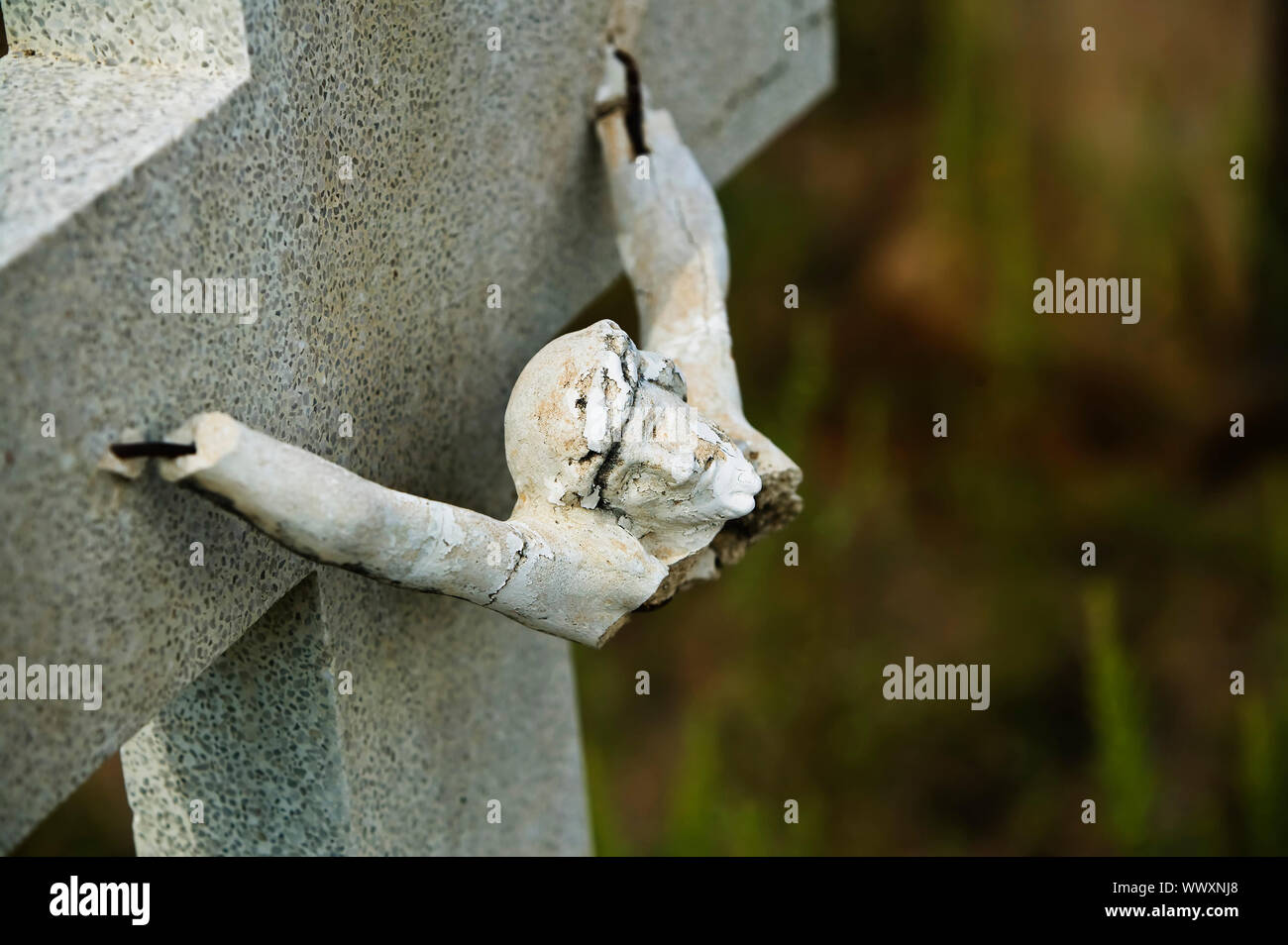 Broken figure of jesus Christ on a grave marker Stock Photo - Alamy