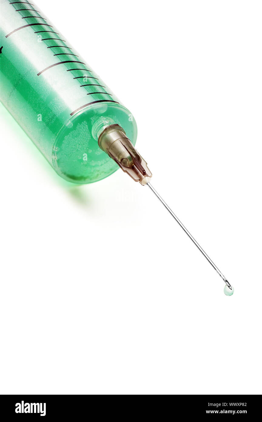 syringe filled with green liquid over white background Stock Photo - Alamy