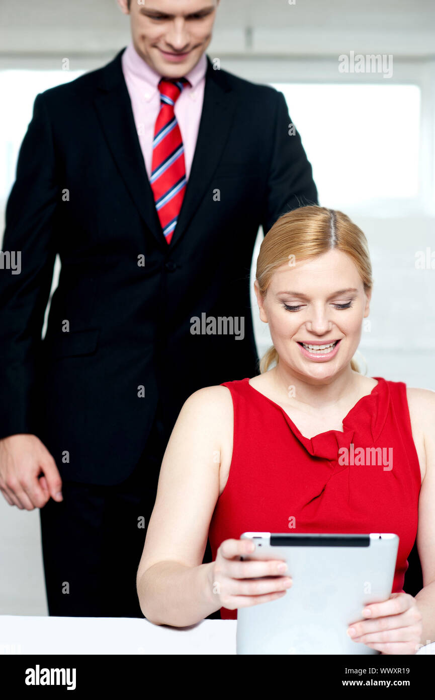 Lady boss standing behind employee hi-res stock photography and images ...