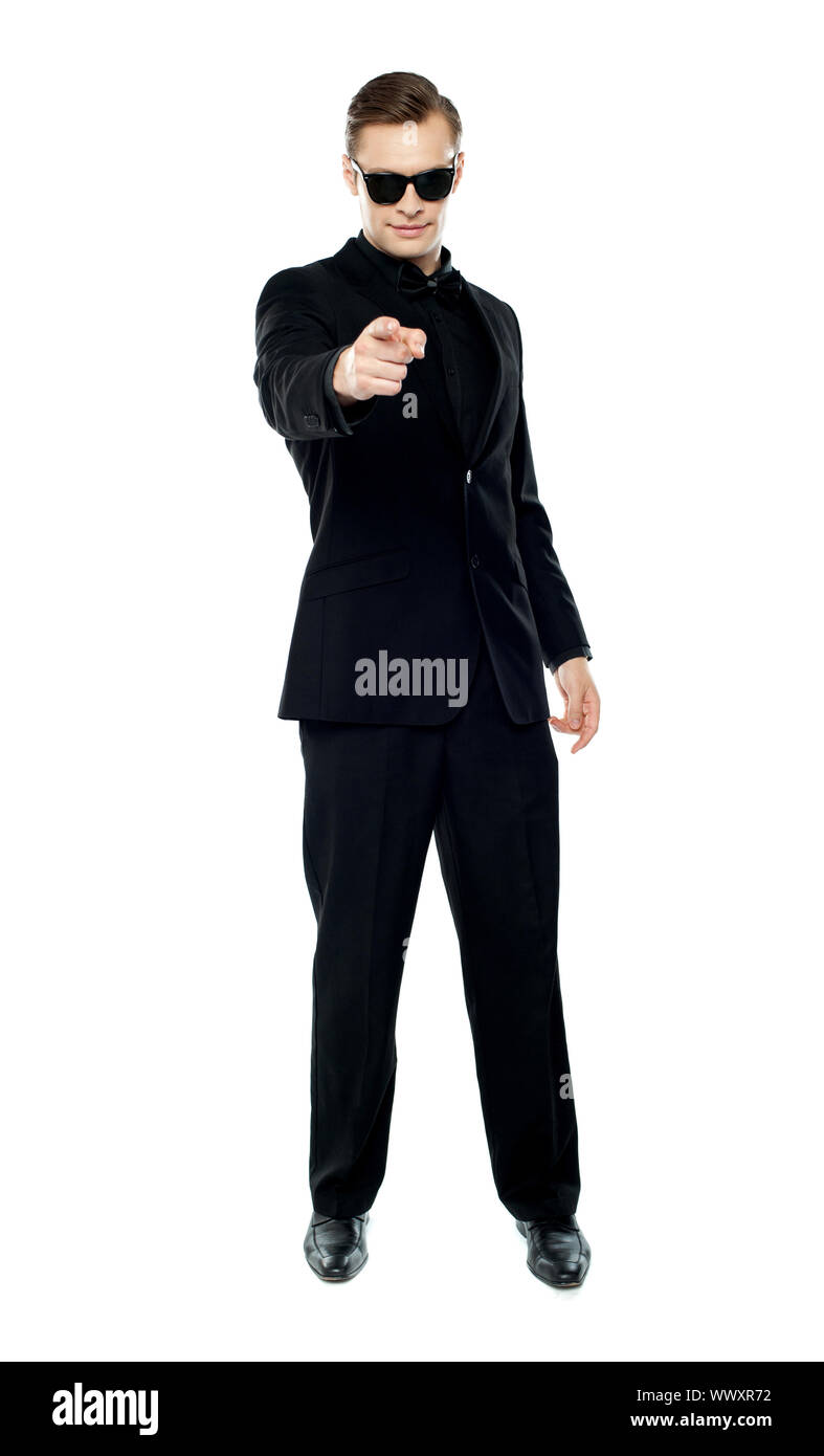 Man in party wear attire pointing at camera wearing black goggles Stock ...