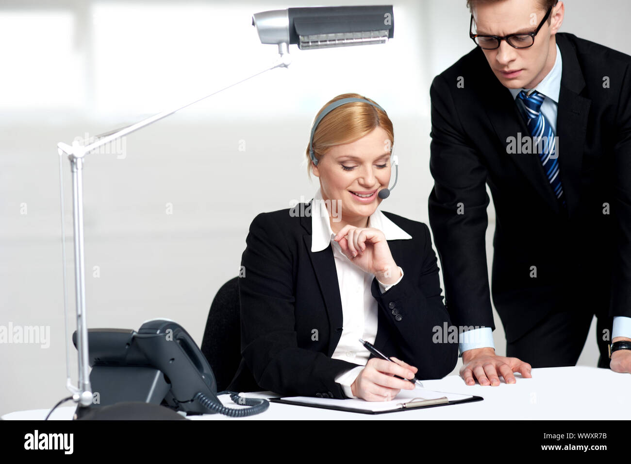 Young business people reading documents in the office and making ...