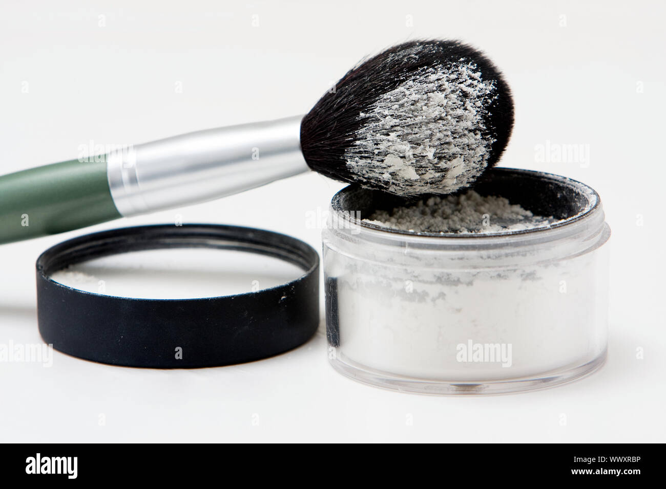 Translucent white powder in a jar and on brush, isolated Stock Photo ...