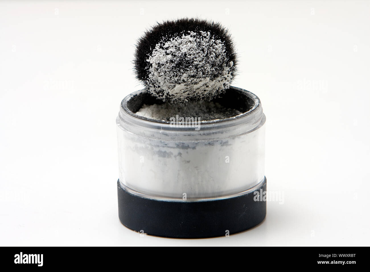 Translucent white powder in a jar and on brush, isolated Stock Photo ...