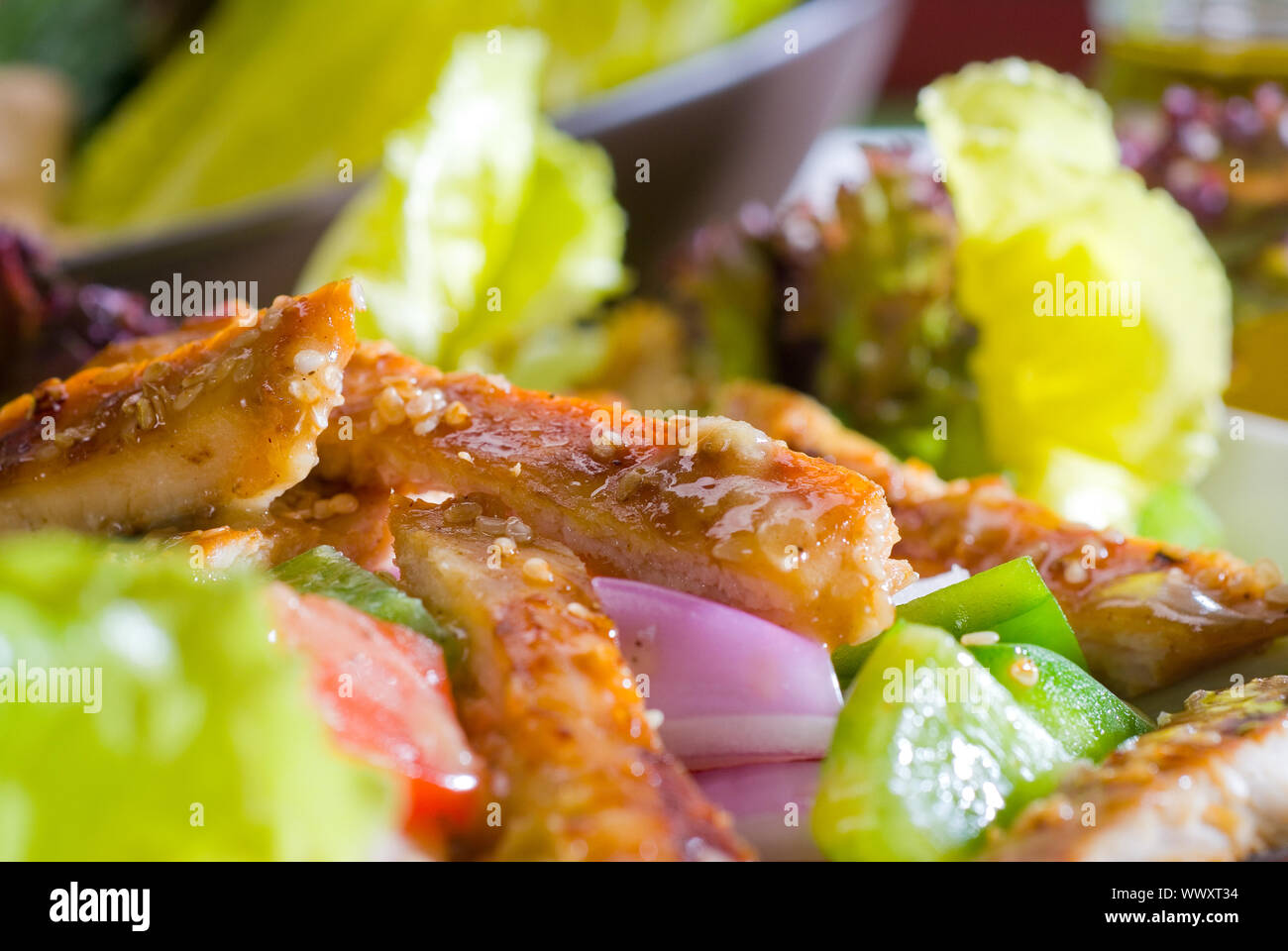 fresh colorfull sesame chicken salad close up Stock Photo - Alamy
