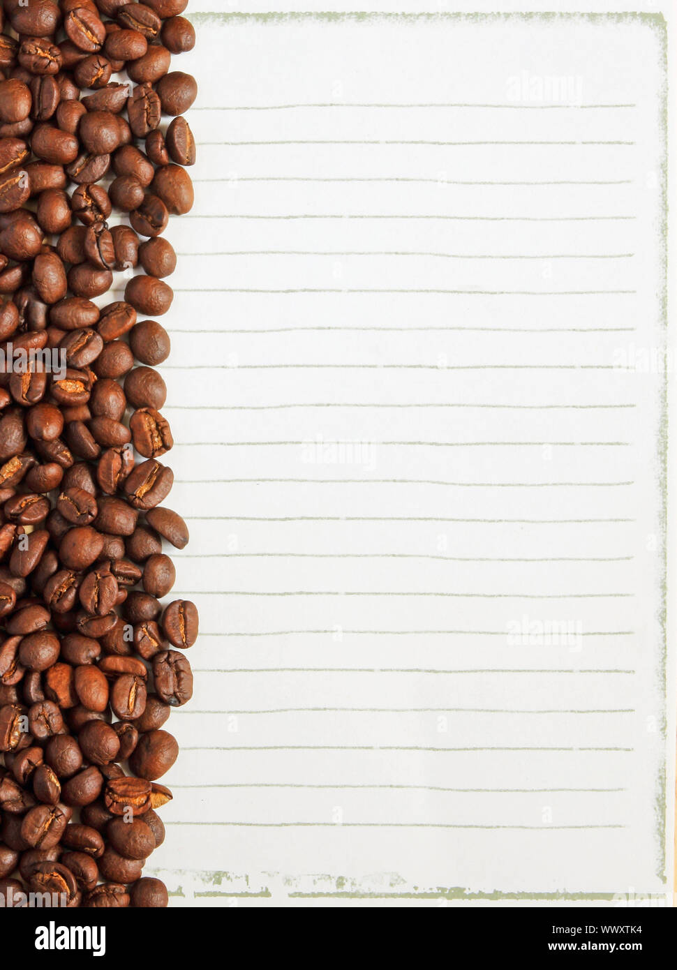 Coffee beans on white paper background for notes Stock Photo - Alamy