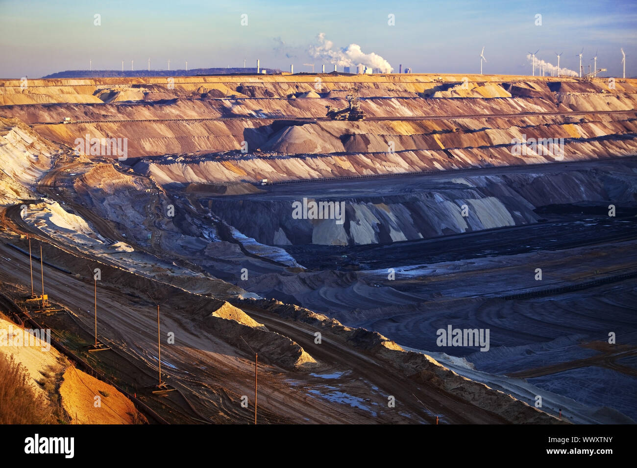 brown coal surface mining with stacker, power plant in background ...