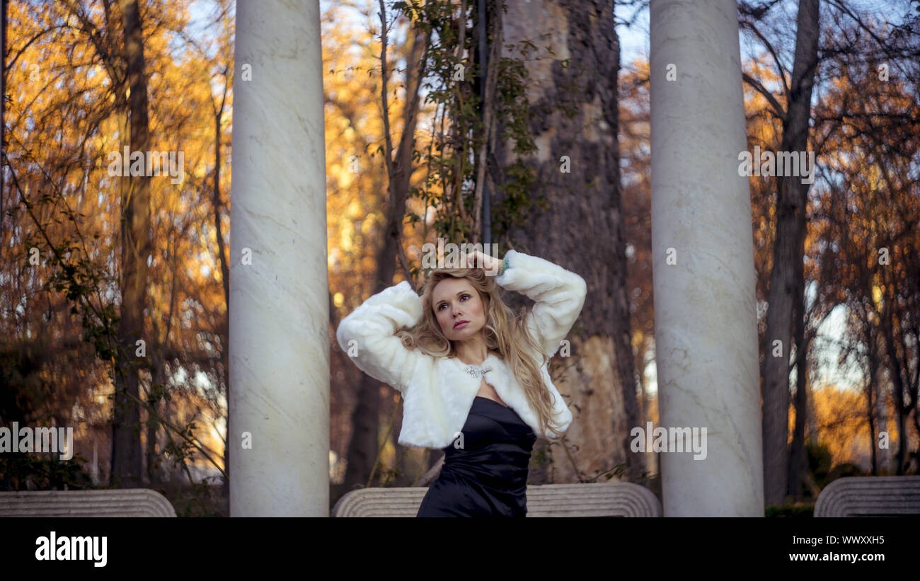 falling, scene of autumn and winter, beautiful blond woman with ...