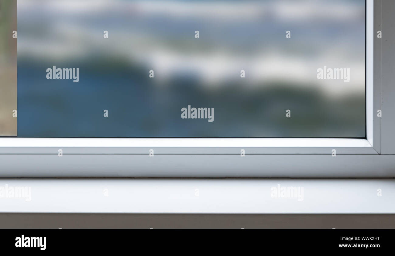 A fragment of the window with blurred background outside the window ...