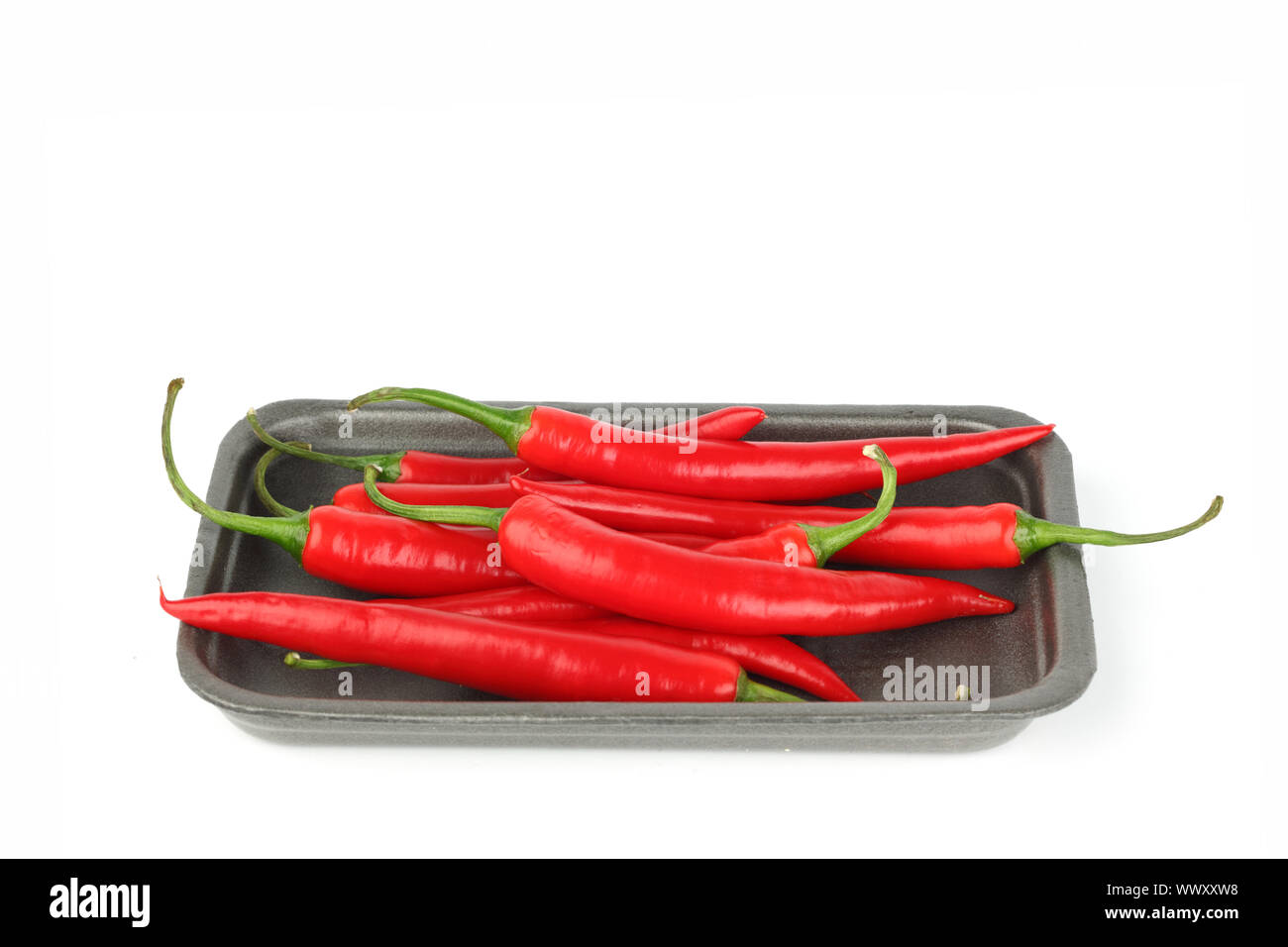 chilli pepper pack isolated on white background Stock Photo - Alamy