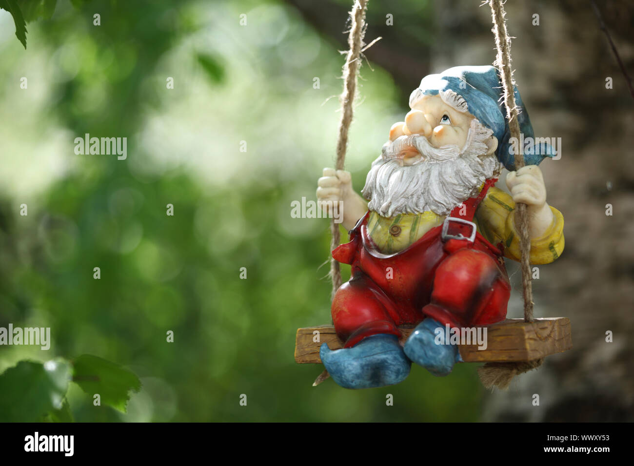 garden dwarf on green nature background Stock Photo - Alamy