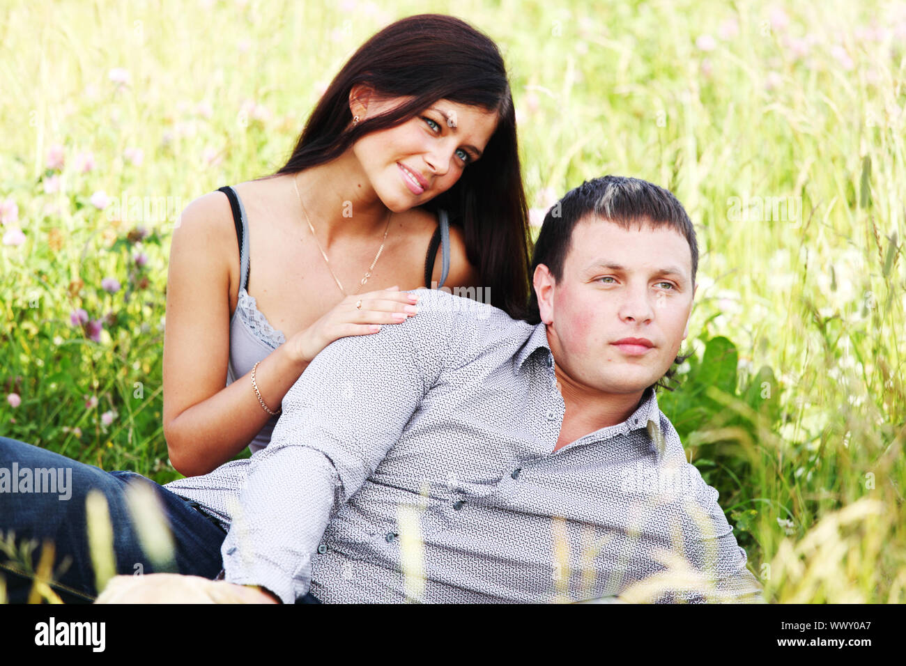 two lovers on grass field Stock Photo - Alamy