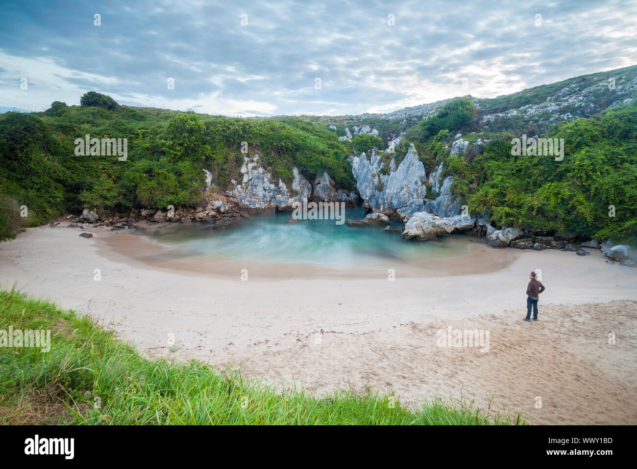 The inner beach of Gulpiyuri near Naves, Asturias, Spain Stock Photo ...