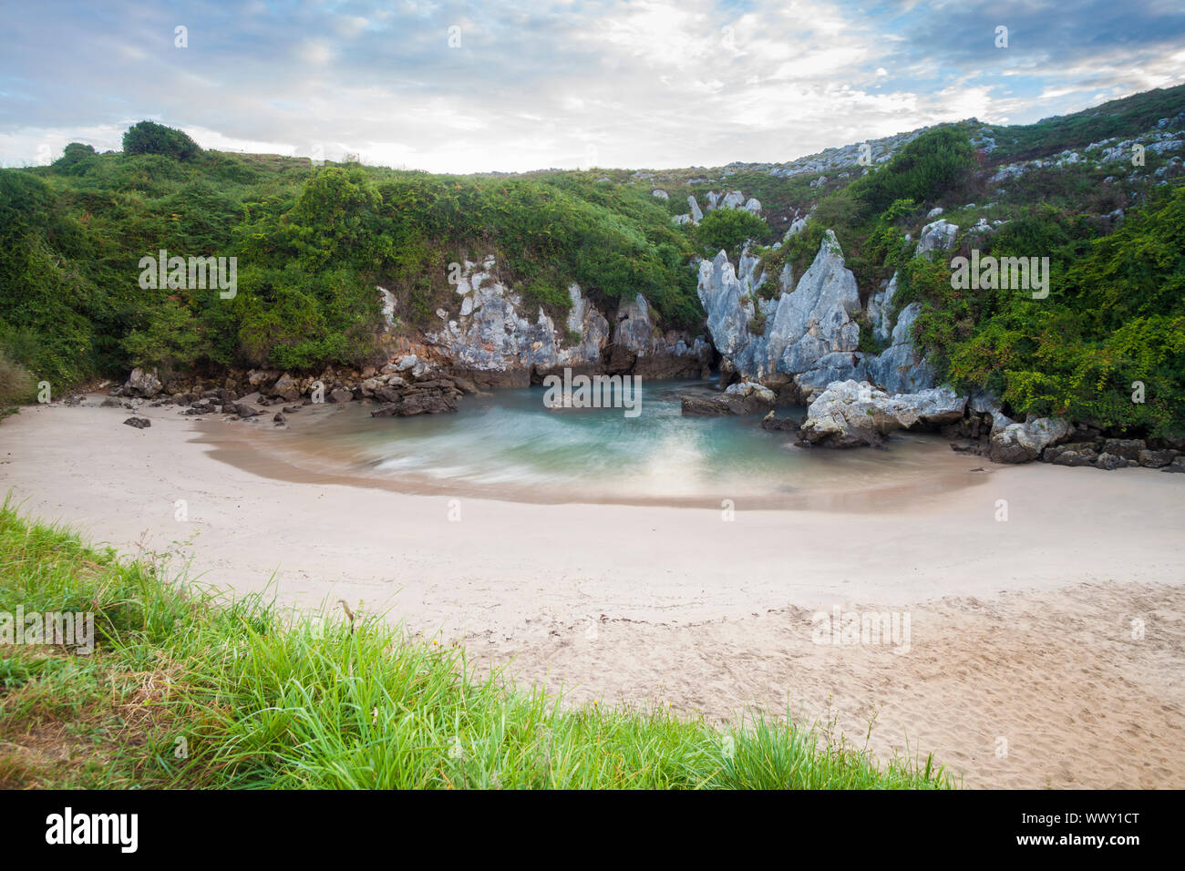 The inner beach of Gulpiyuri near Naves, Asturias, Spain Stock Photo ...