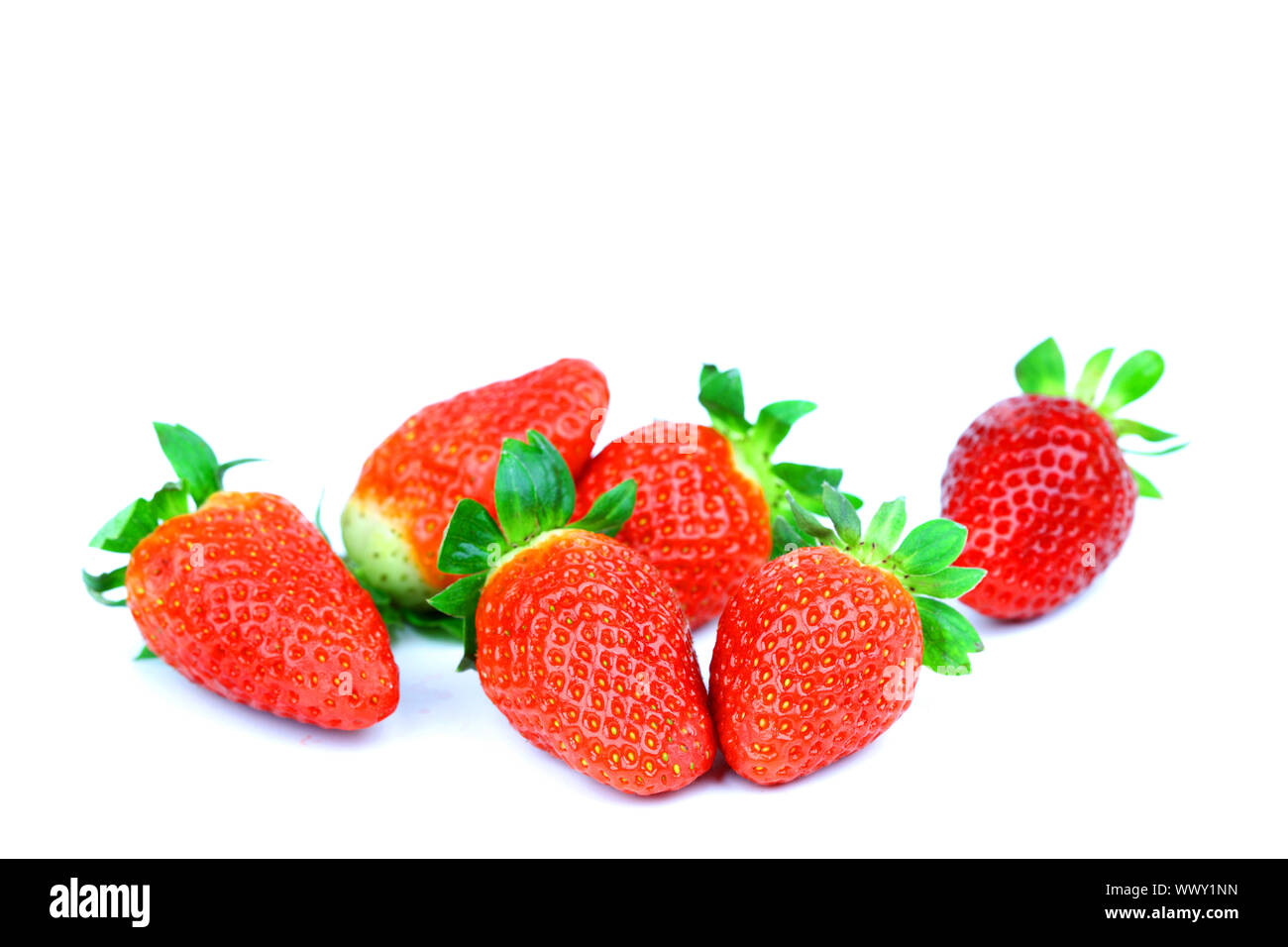 strawberry pile isolated on white background Stock Photo - Alamy