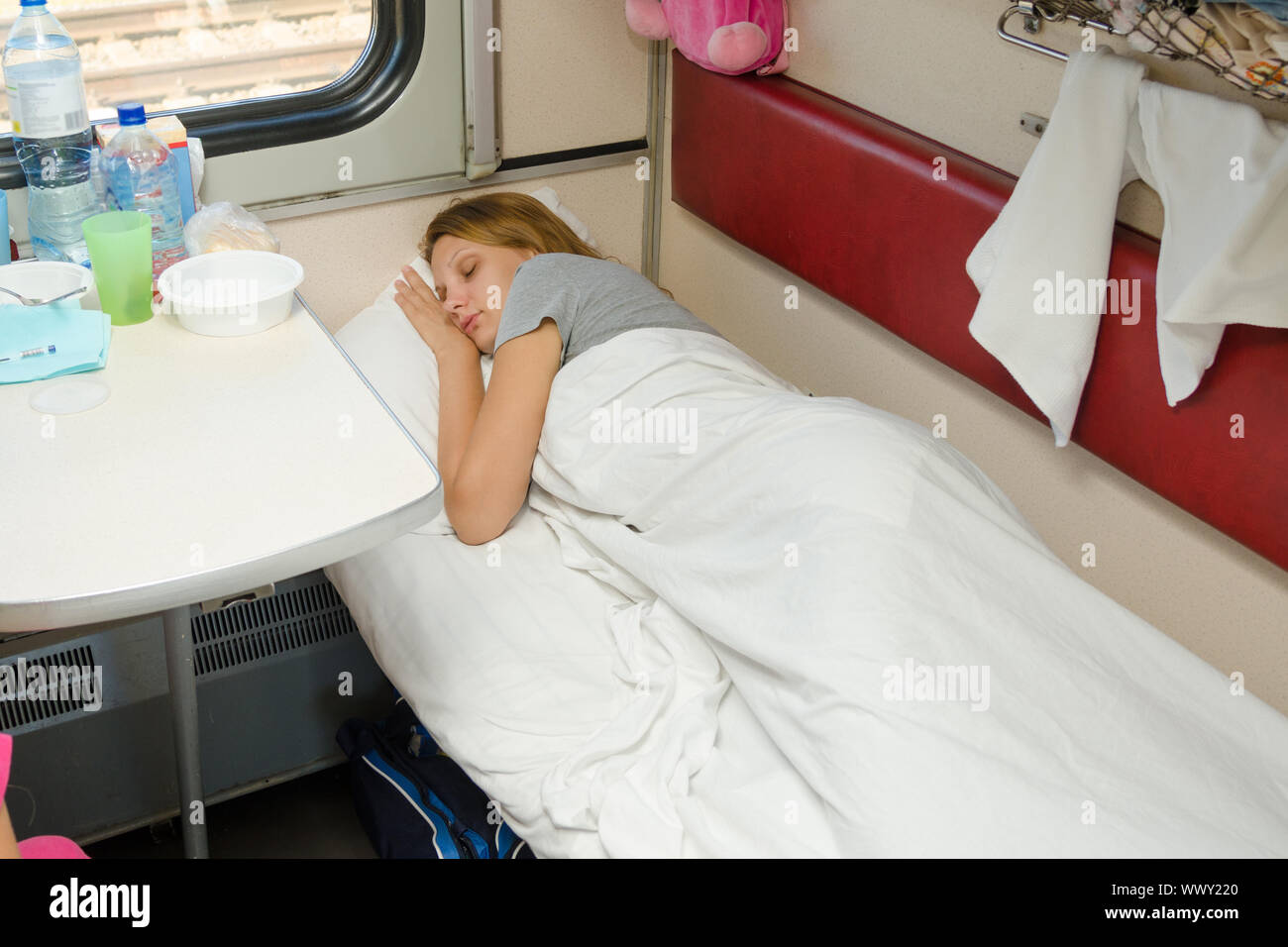 Girl sleeping on train hi-res stock photography and images - Alamy