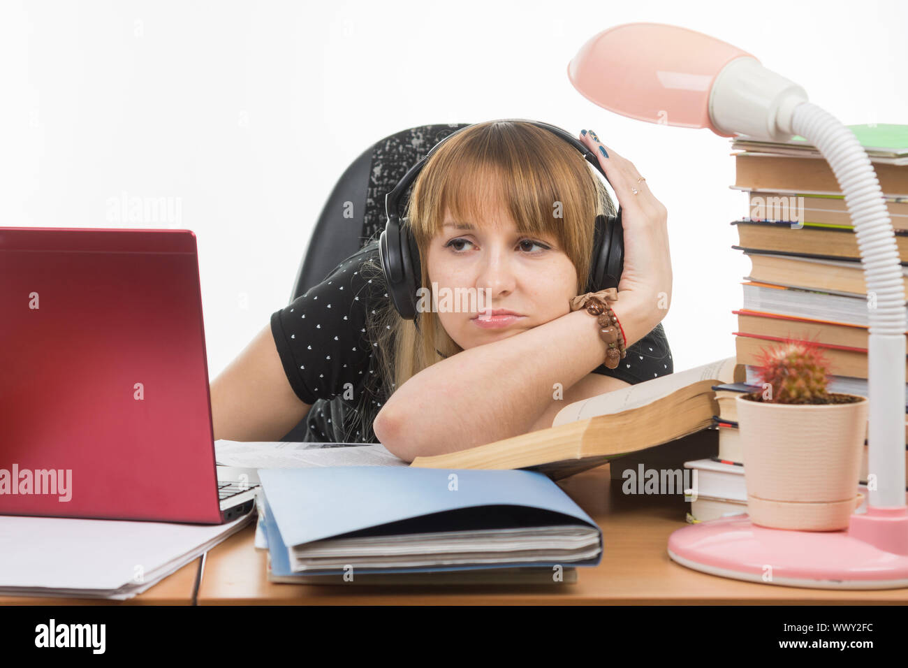 Student thinking sadly looks at the laptop screen Stock Photo - Alamy