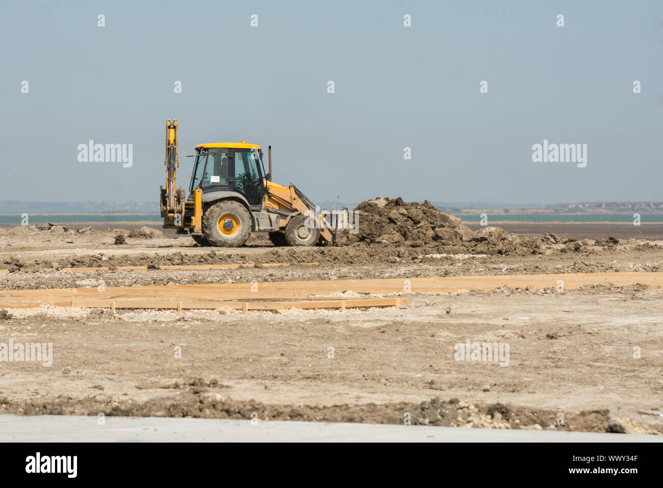 Excavator prepare the site for construction Stock Photo - Alamy