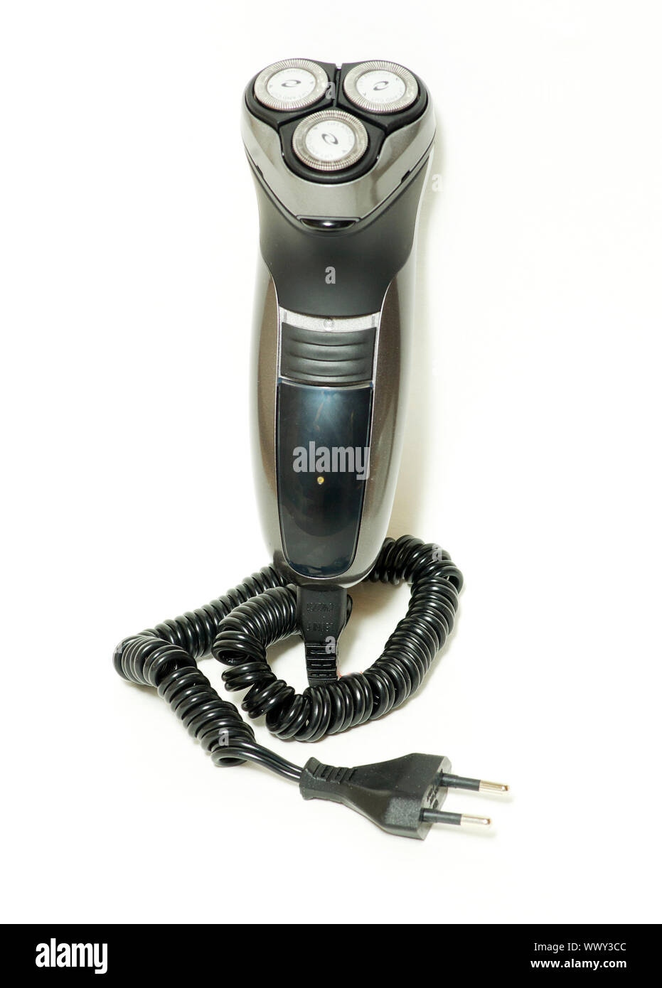 Close up on an electric razor laying sideways Stock Photo - Alamy