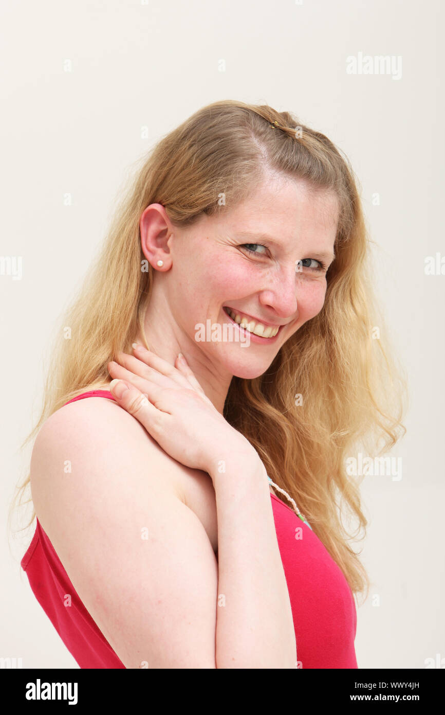 Elated Attractive Middle Aged Blonde Woman Smiling In Pleasure As She