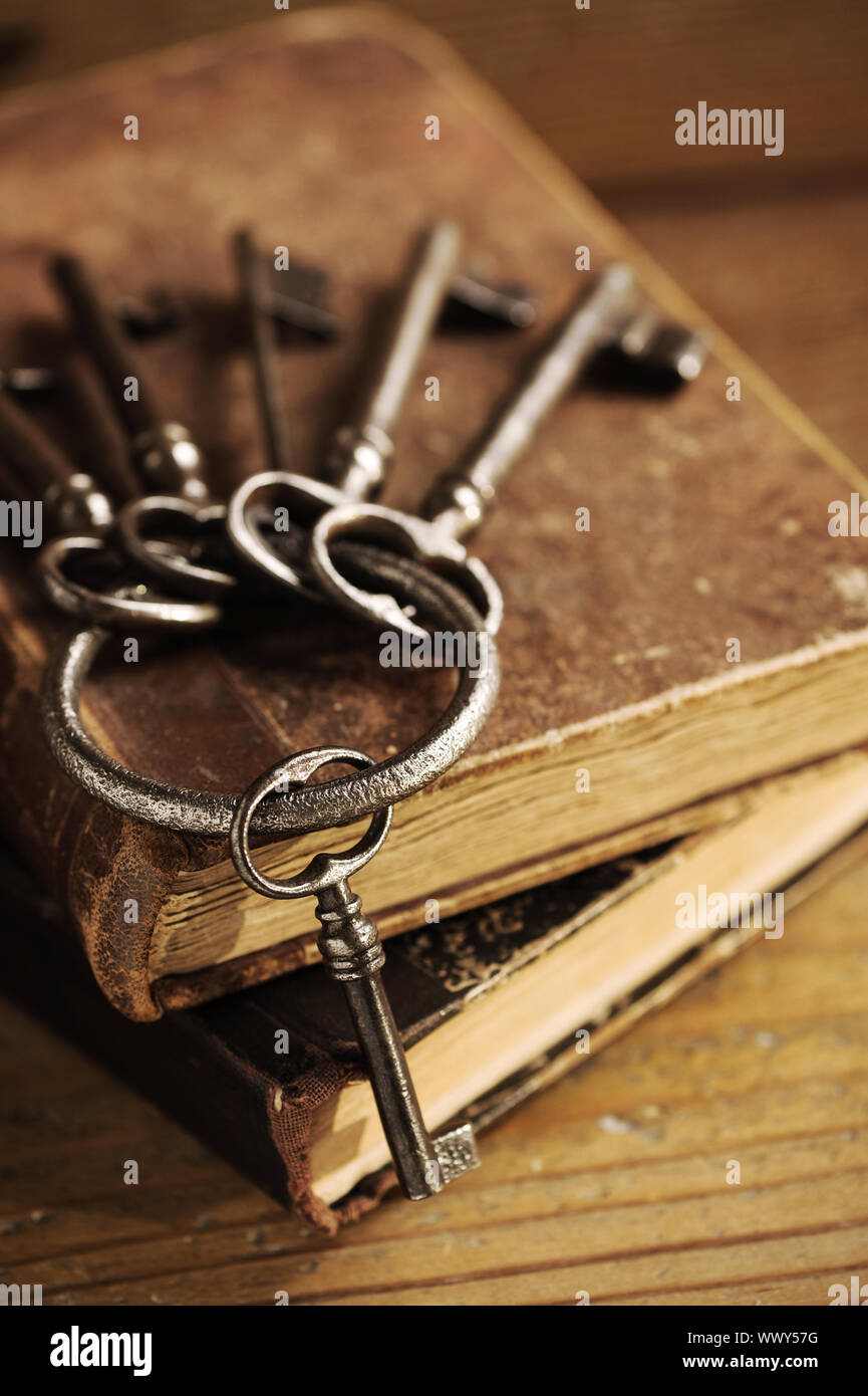 old keys on a old book, antique wood background Stock Photo - Alamy