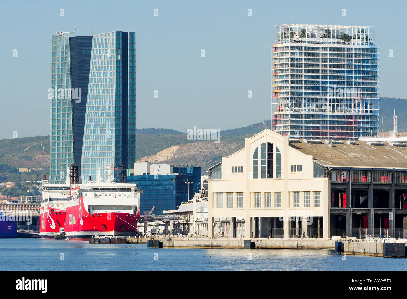 CMA-CGM and La Marseillaise Towers and ferries in La Joliette harbor ...