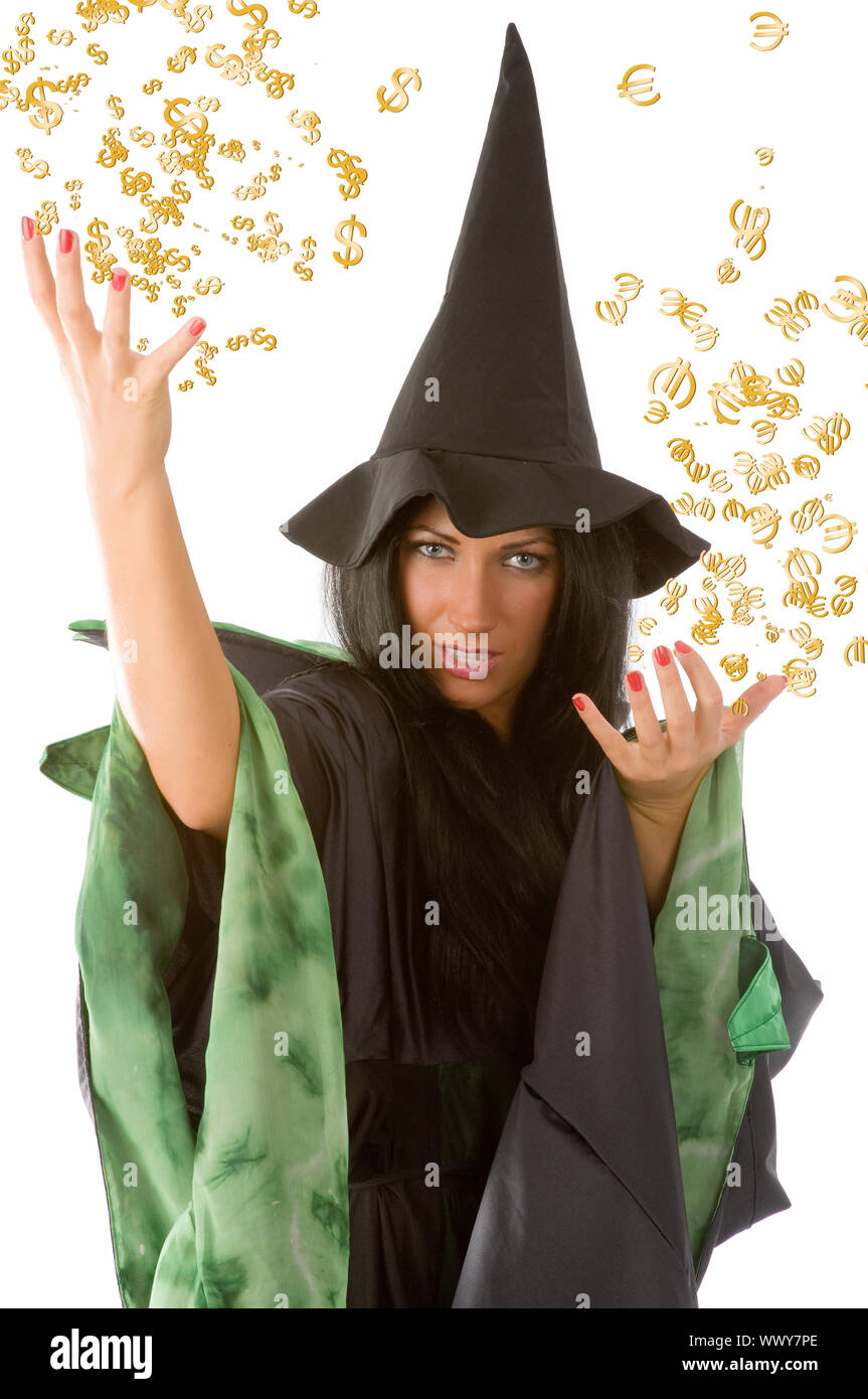 pretty woman in witch dress making money from a spell Stock Photo - Alamy