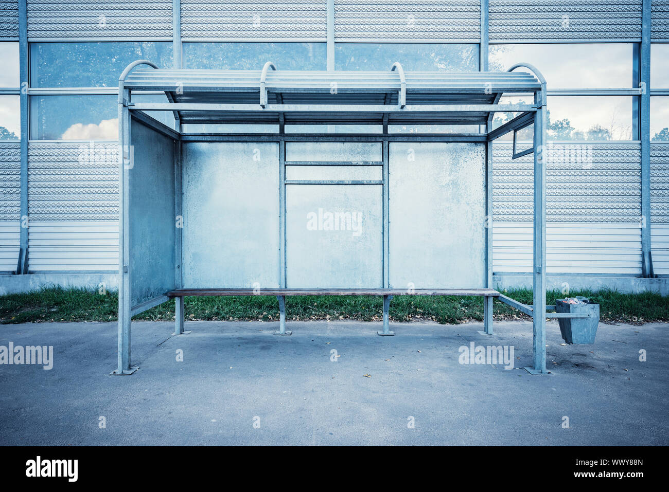 Empty metal bus stop by the highway Stock Photo - Alamy