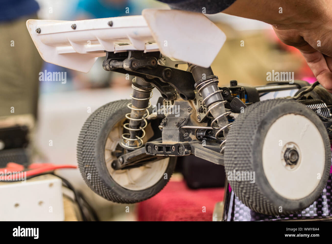 Maintenance of radio-controlled model of the car in a break between ...