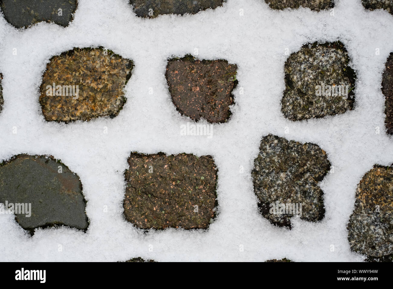 Stones with snow hi-res stock photography and images - Alamy