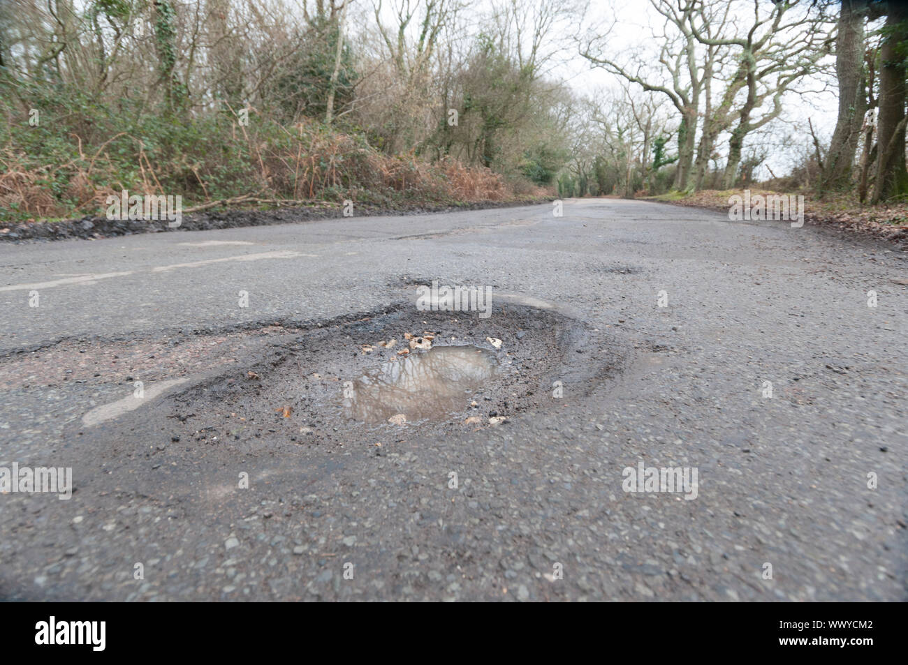Pot holes in road surface 2017 Stock Photo - Alamy