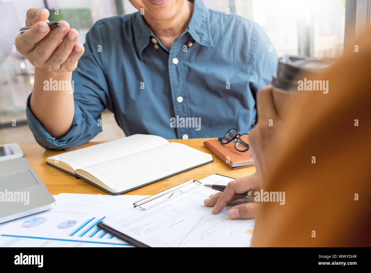Business creative coworkers team Meeting Discussing showing the results ...