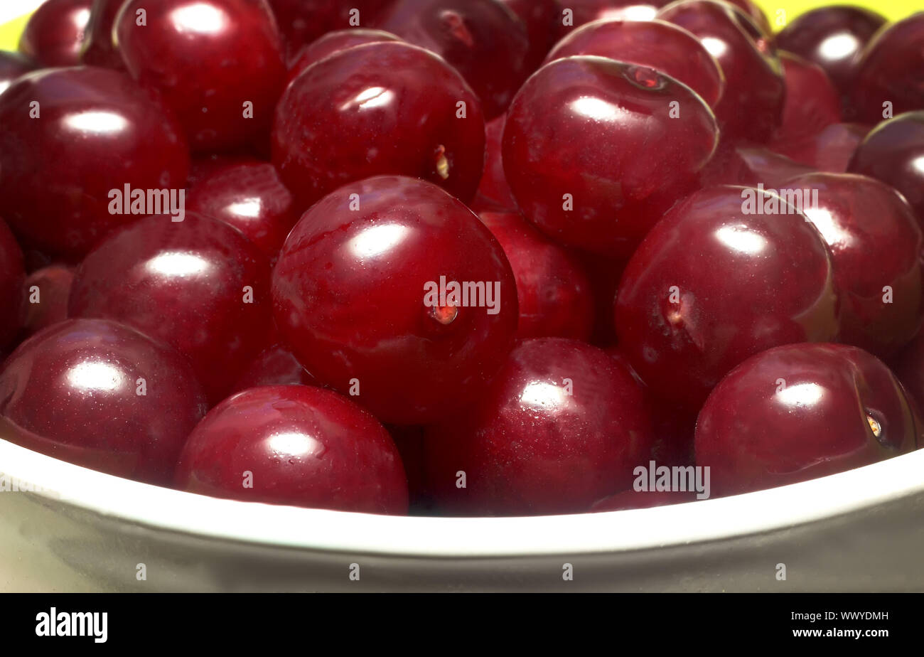 Delicious ripe cherries in a ceramic vase Stock Photo - Alamy